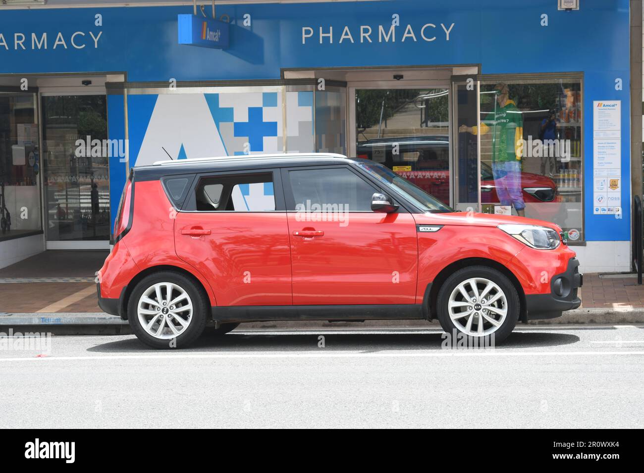 Red KIA soul car parked on curbside Stock Photo - Alamy