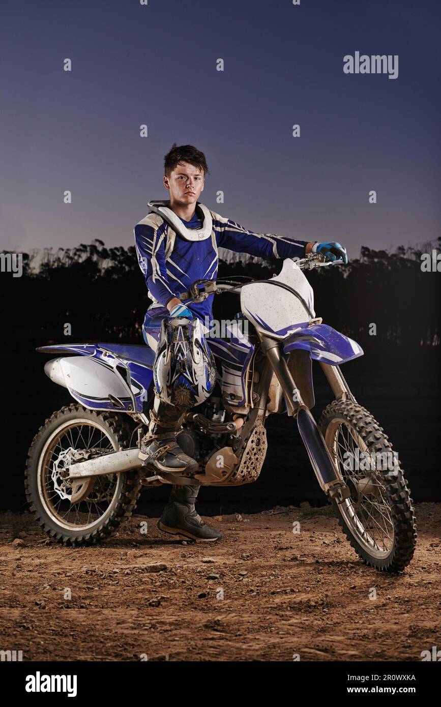 Ready to take on anything. Portrait of a young motocross rider posing ...