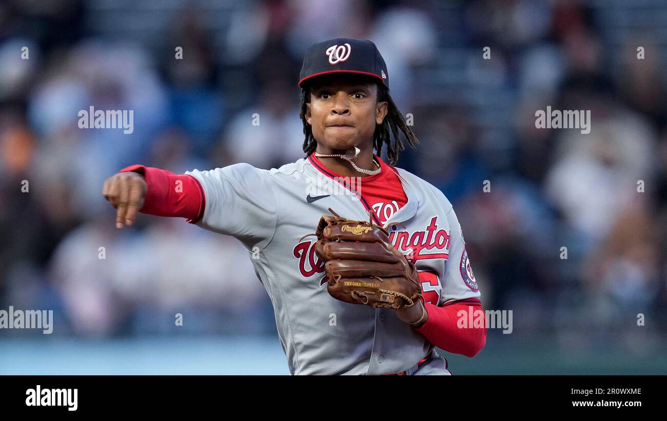 Washington Nationals shortstop CJ Abrams, left, turns a double play ...