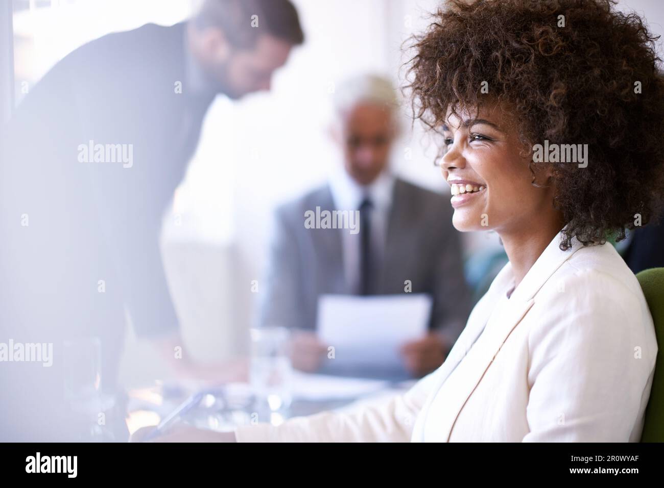 Getting the job done with teamwork. a group of business colleagues meeting in the boardroom ...
