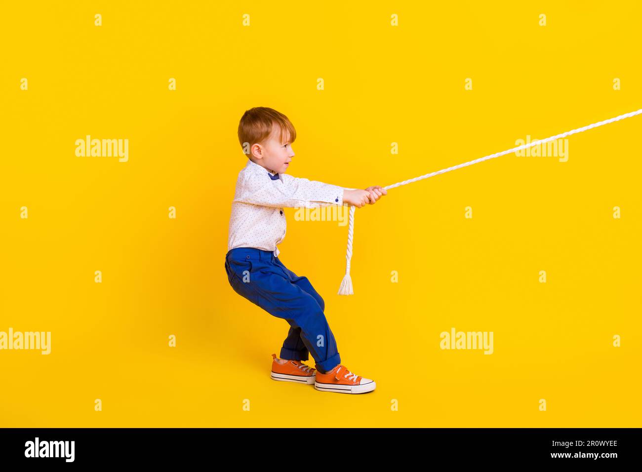 Profile side full body photo of little boy feel strong complete ...