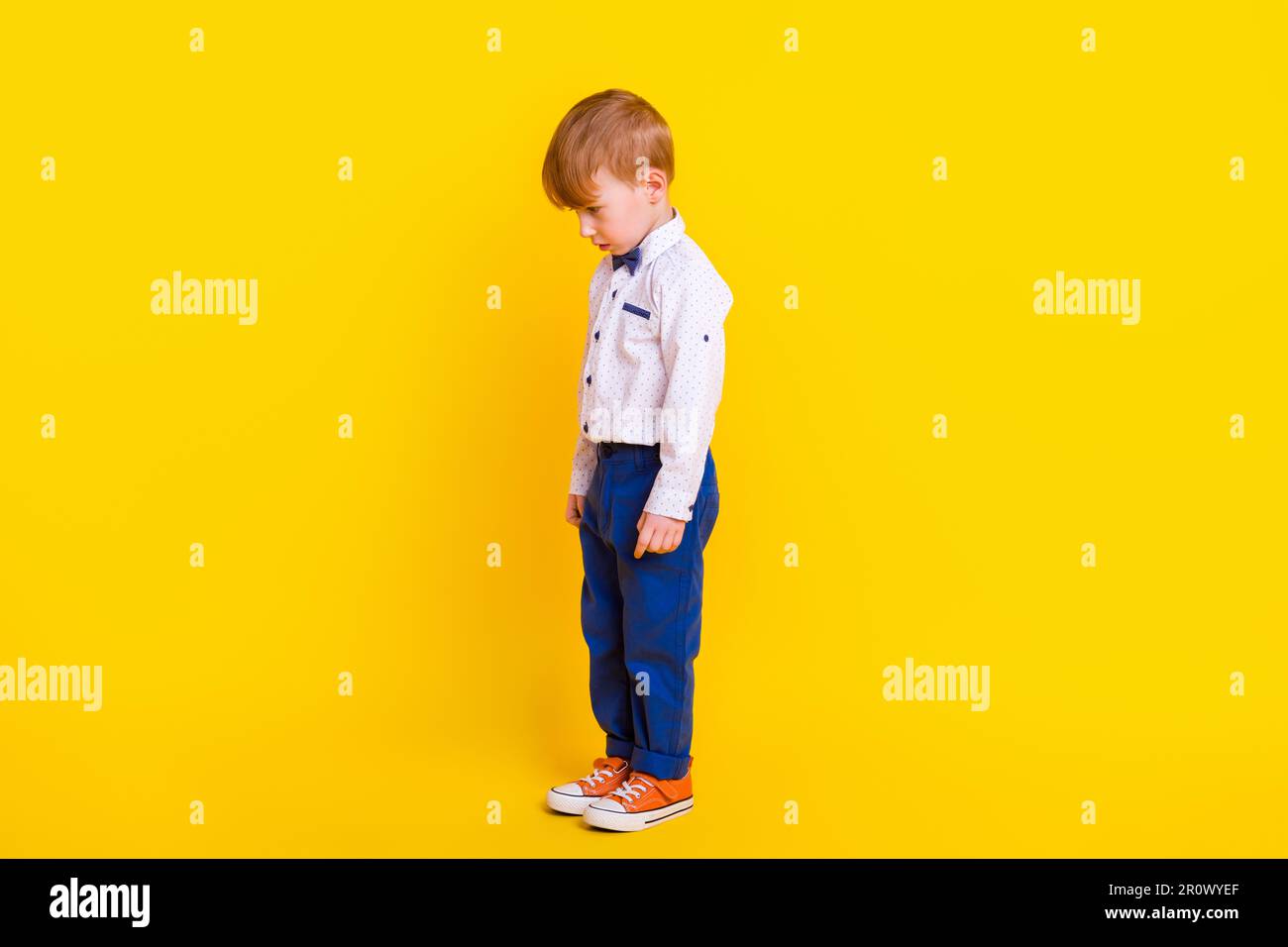 Profile side full body photo of disappointed abuse kid standing guilty ...