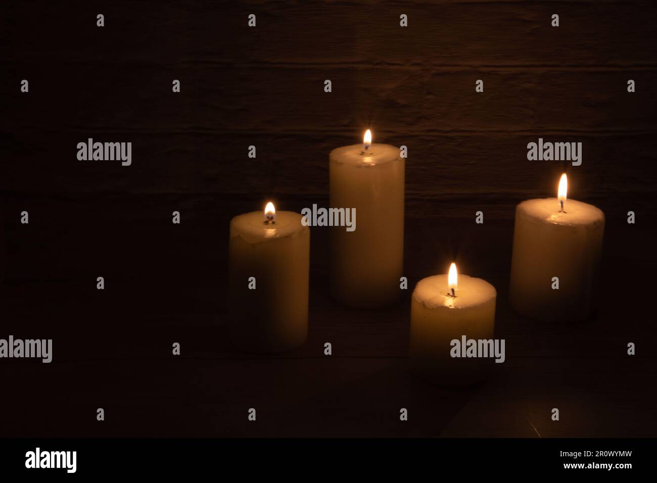 Group lit candles on table hi-res stock photography and images - Alamy