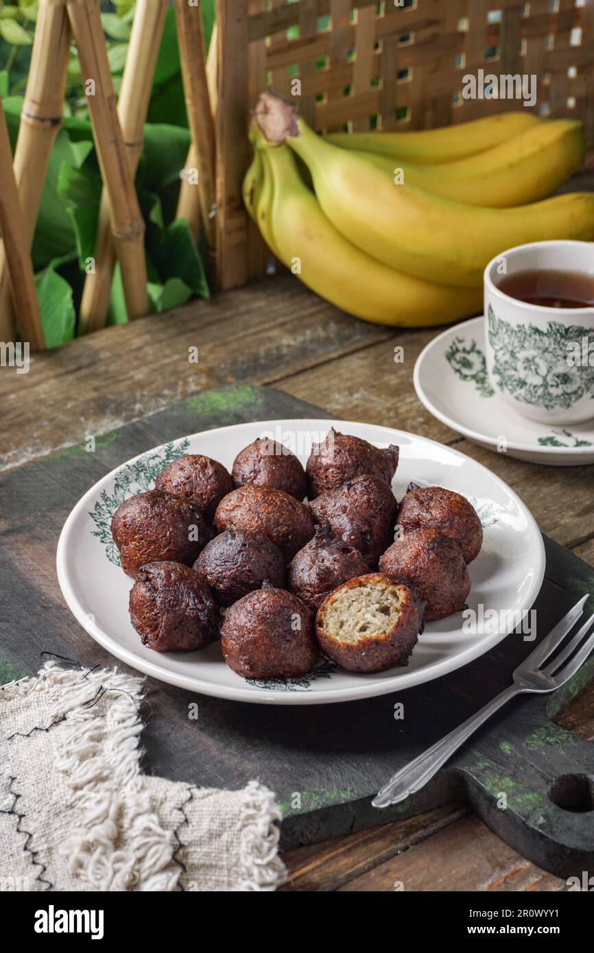 Malaysian fritter snack deep fried banana balls or Malay as Cekodok ...