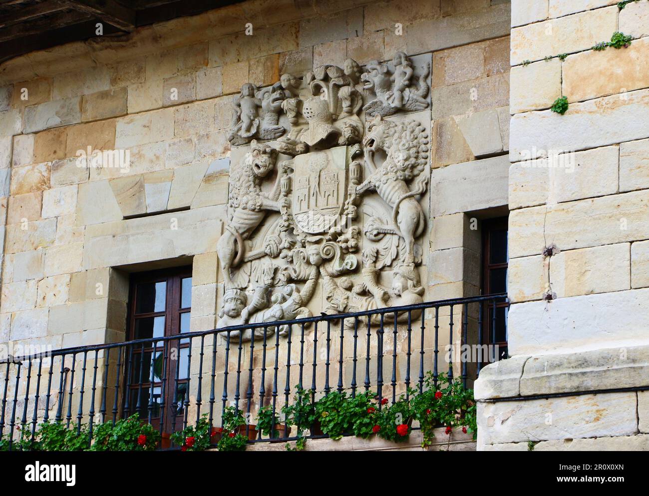 Stone carved coat of arms on the wall of the Casa de los Cossío ...