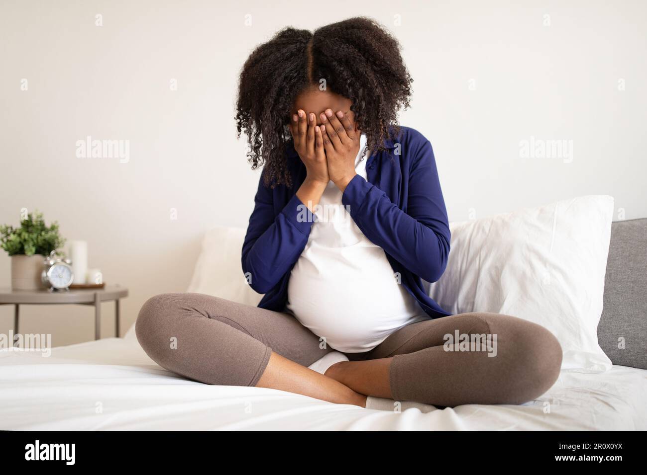 Sad unhappy millennial african american pregnant lady with big belly ...