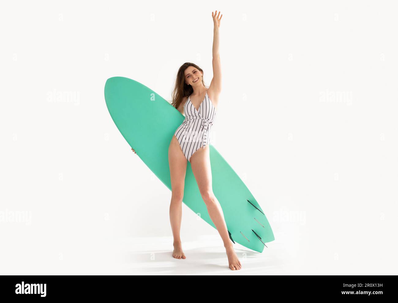 Extreme water sport concept. Optimistic young slim woman in swimsuit ... Extreme water sport concept. Optimistic young slim woman in swimsuit ...