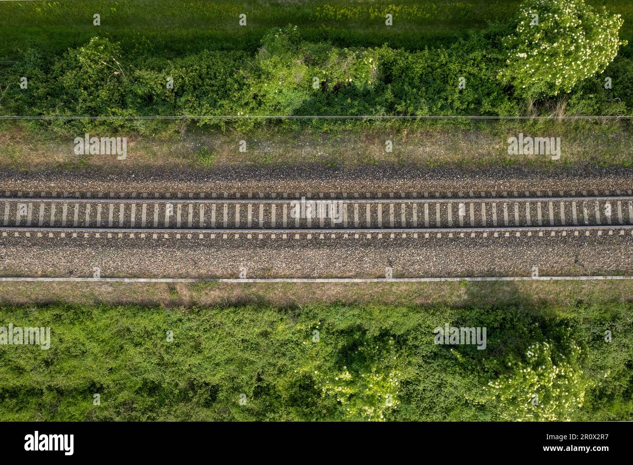 Flying over railway tracks, top view. Railway track tracks line railroad train rail aerial photo ...