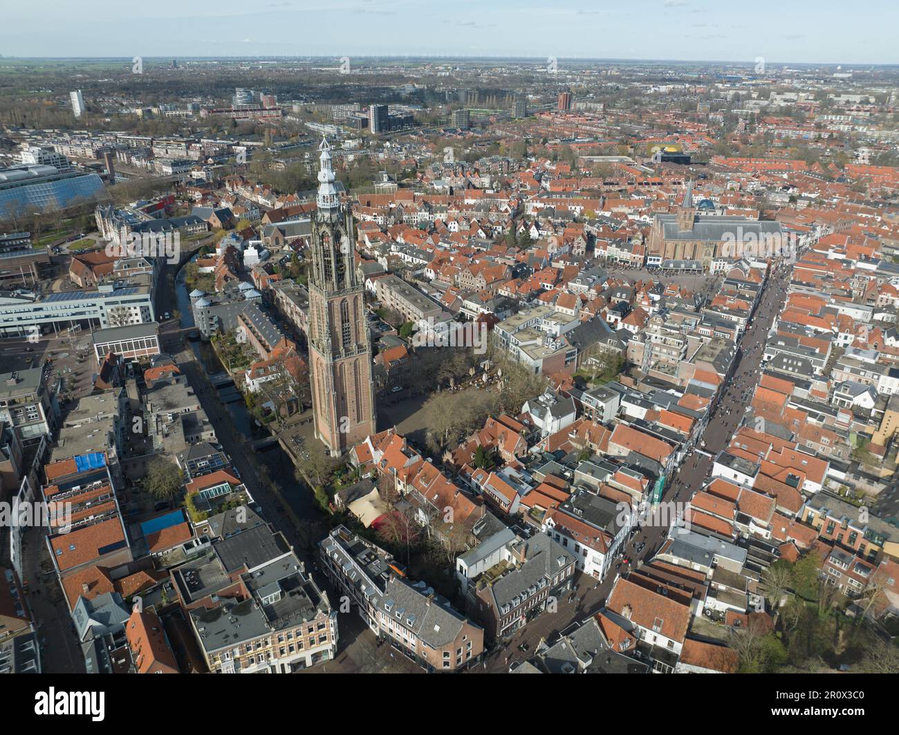 The towering church spire of Onze Lieve Vrouwetoren rises above the ...