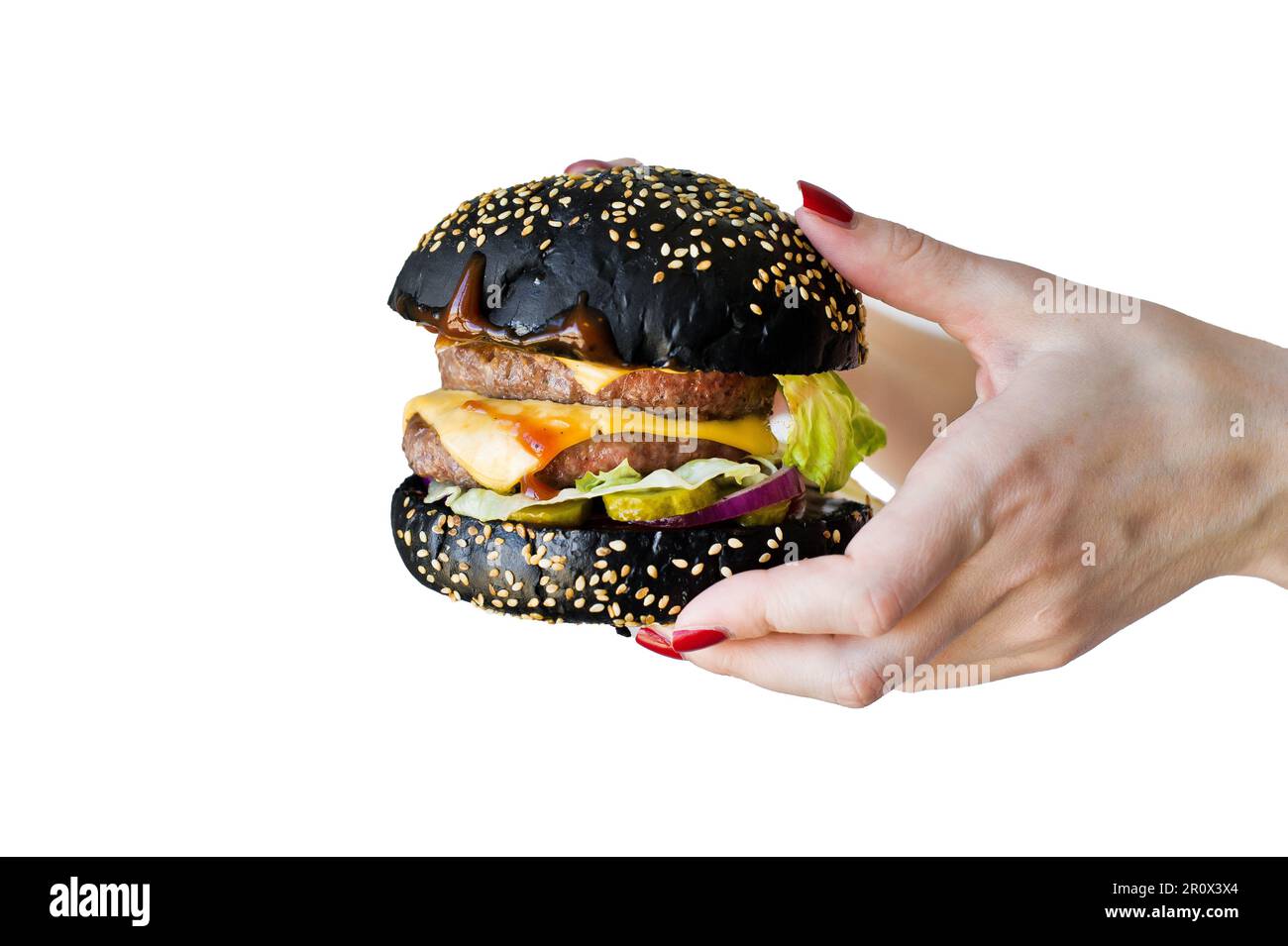 Black burger in hands hi-res stock photography and images - Alamy