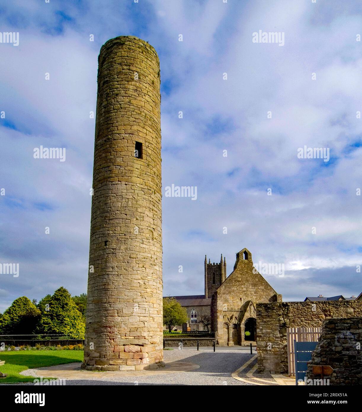 Roscrea Round Tower with St. Conrad's church with its Romanesque ...