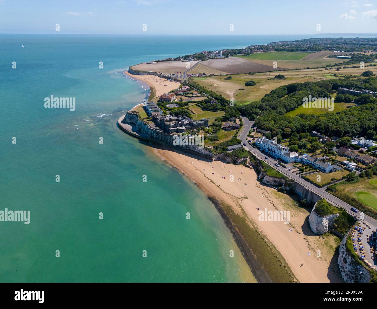 An aerial view of Broadstairs with its sandy beach and lush greenery ...