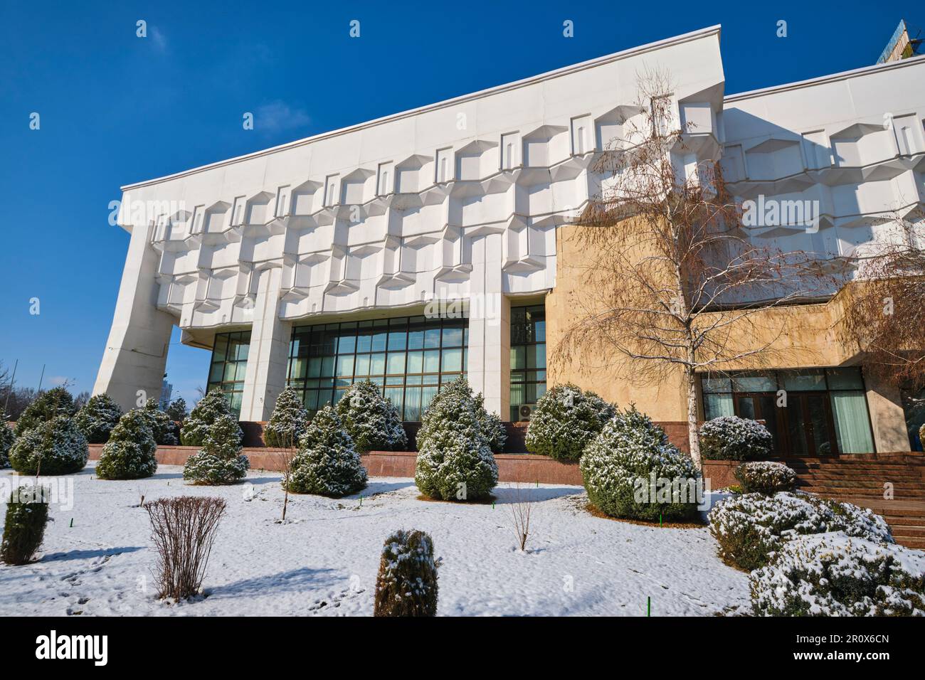 View of the modern, Brutalist style facade of the Turkistan Concert ...