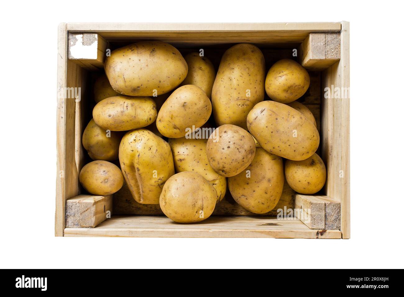 Potatoes in a wooden box, supermarket. Isolated on white background ...