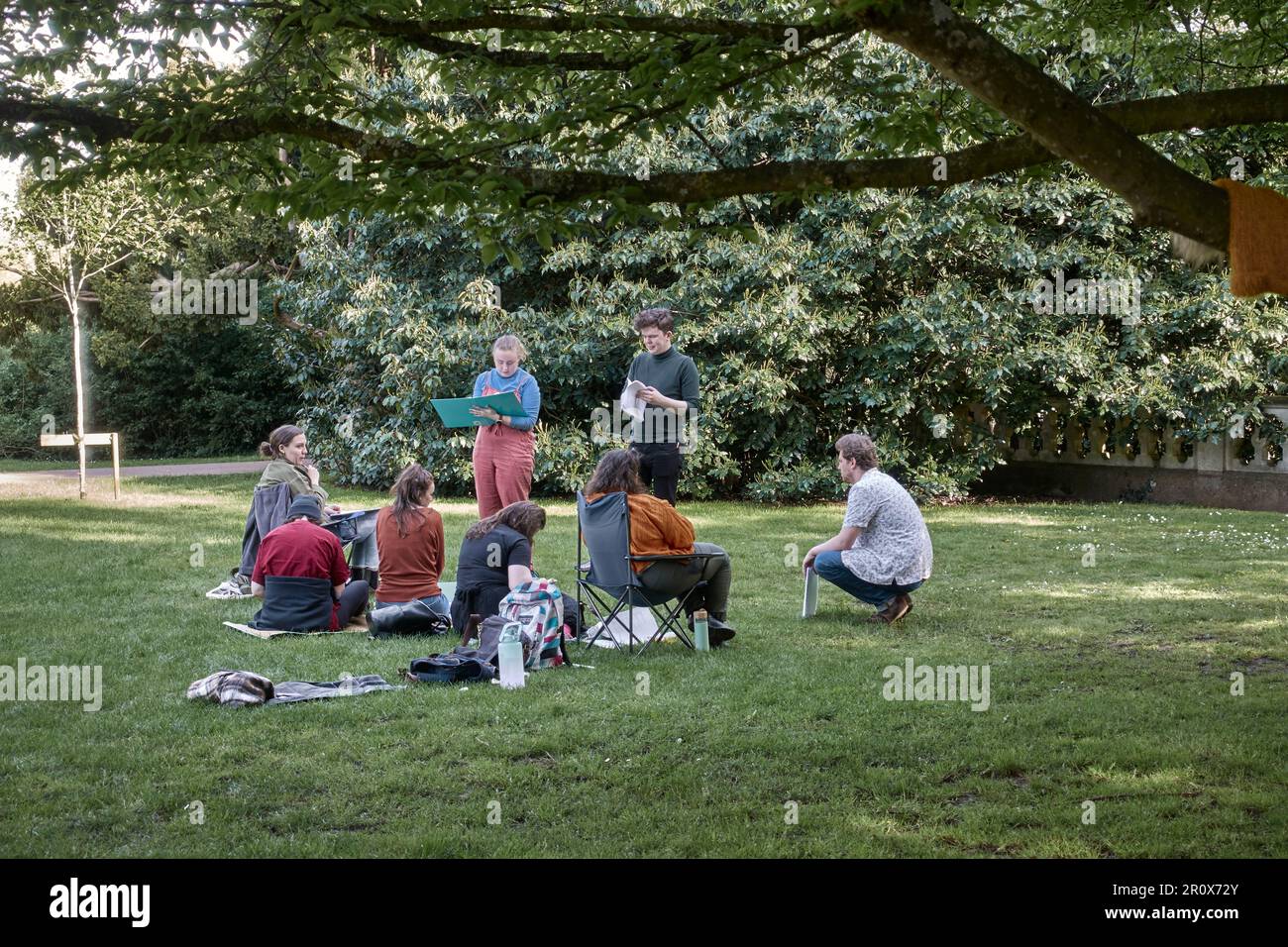 Group study outdoor. Young actors studying outside in the RSC theatre ...