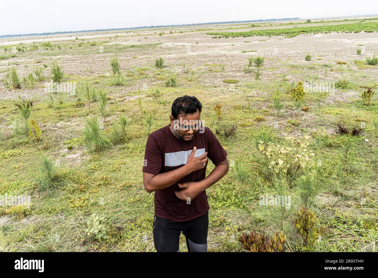 Close-up shot of Asian Bangladeshi man with hand on chest. Man With ...