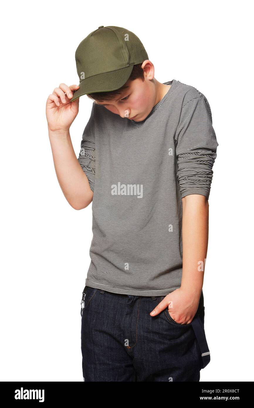 Fashion, cool and a shy teenager with a cap isolated on a white ...