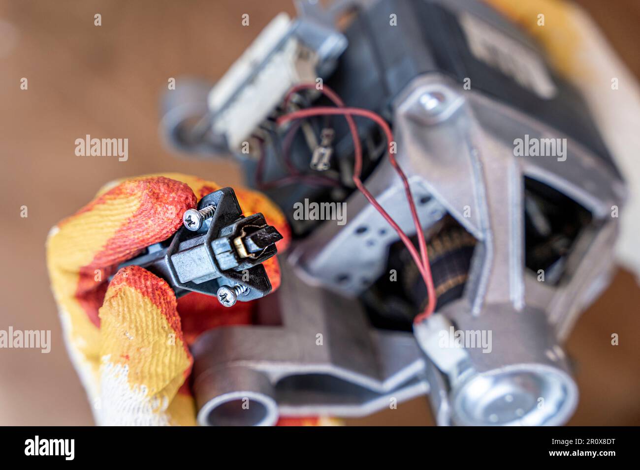 process of repairing the electric motor of a washing machine Stock ...
