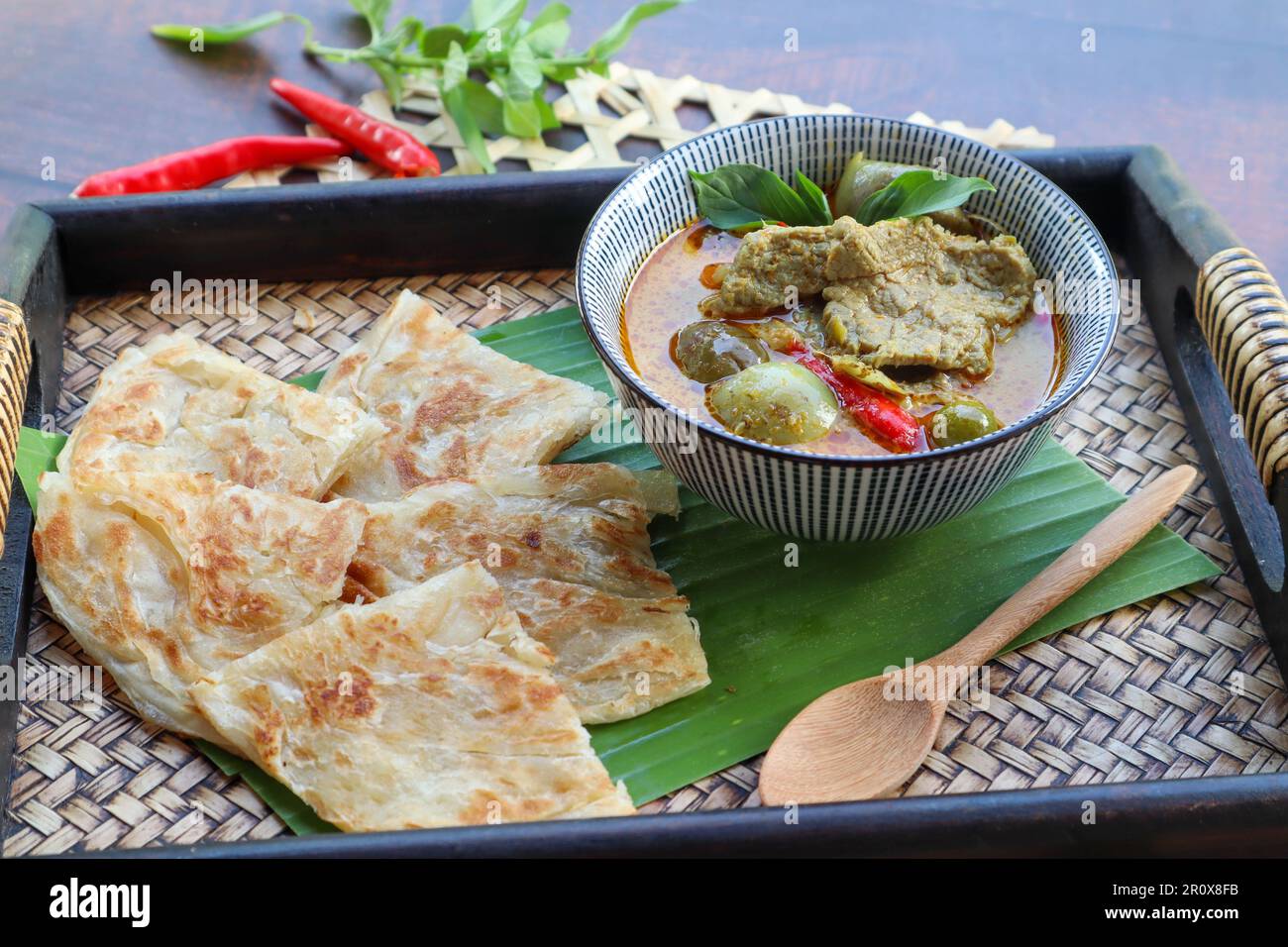 Thai green curry beef served with Roti at top view - Thai food called ...