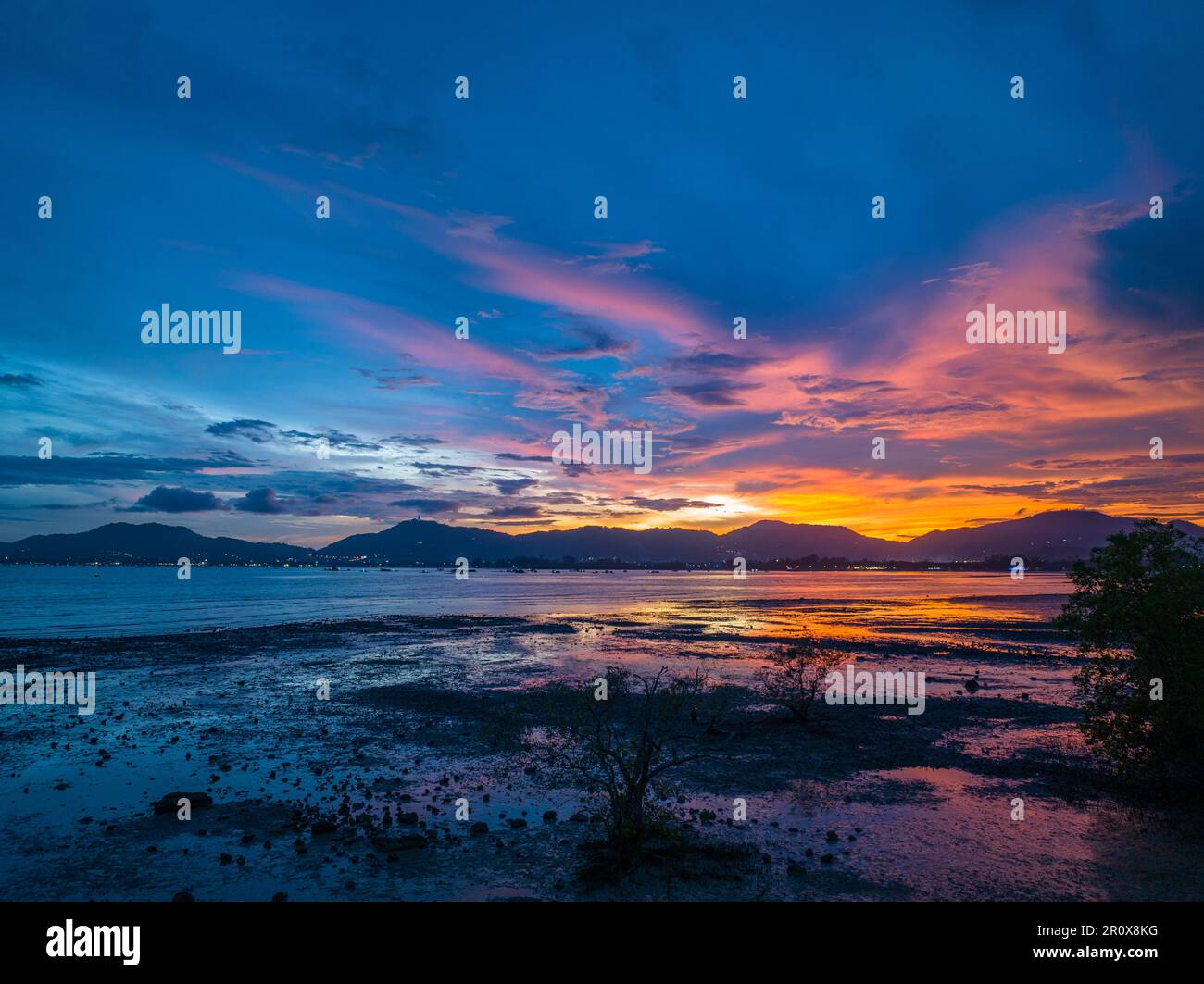 aerial view reflection of colorful cloud in bright sky of sunset above the ocean at Khao Khad ...