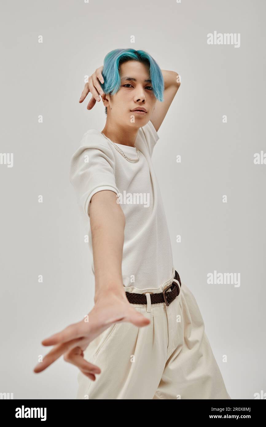 Vertical image of stylish dancer showing exercises against white ...