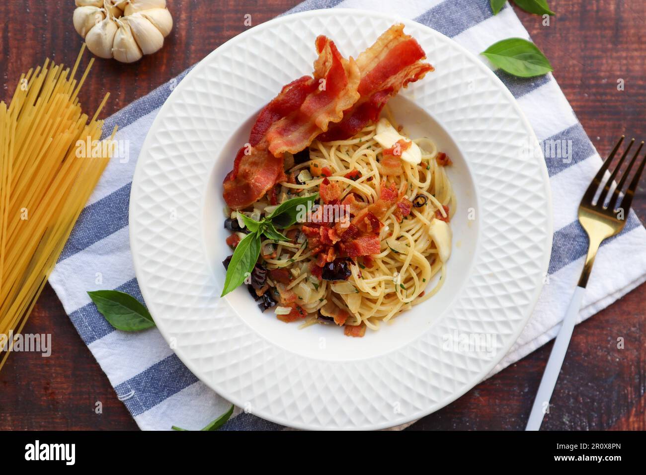 Spaghetti with bacon and dried chili at top view - Spaghetti Aglio E ...