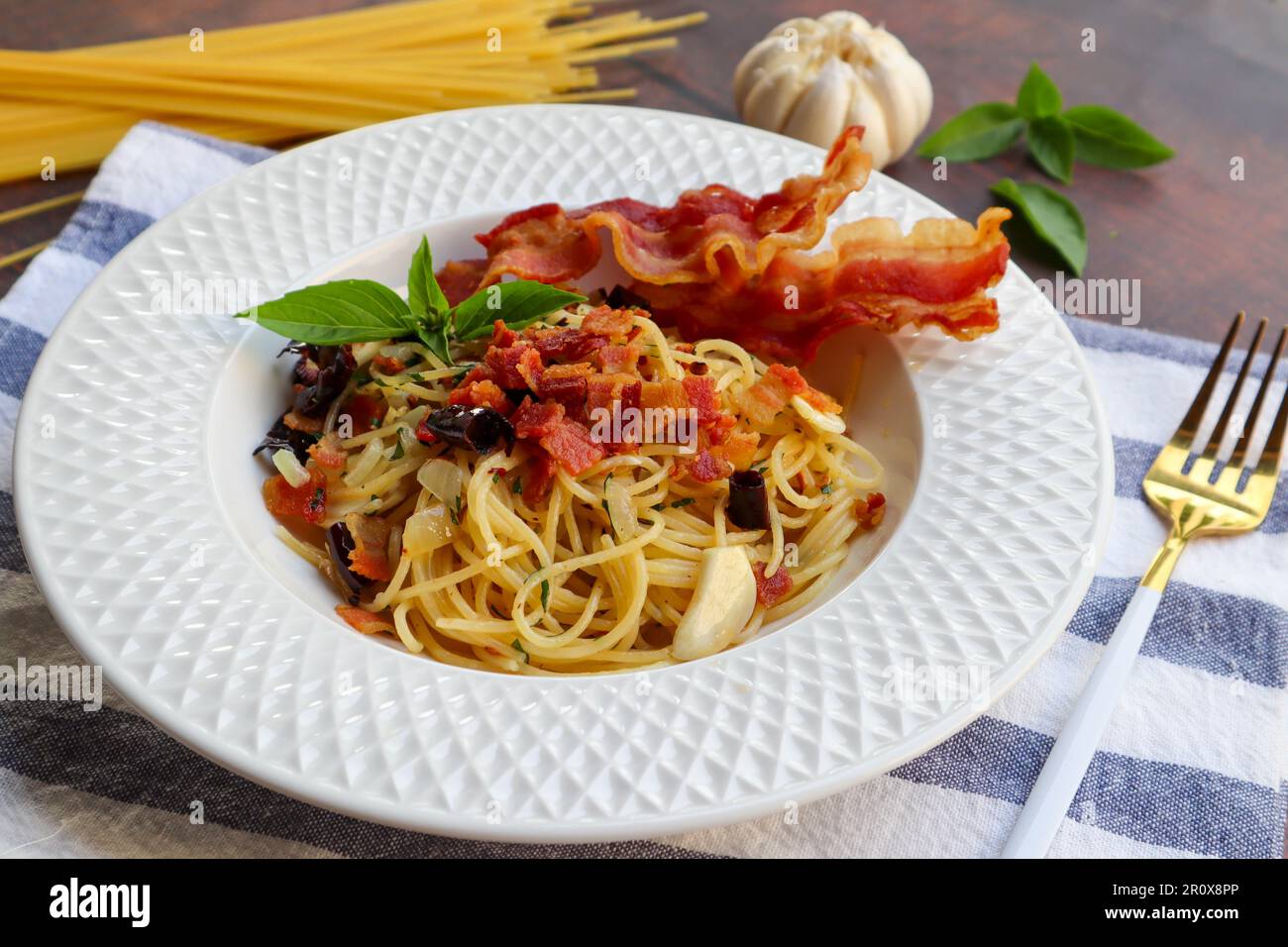Spaghetti with bacon and dried chili at close up view - Spaghetti Aglio ...