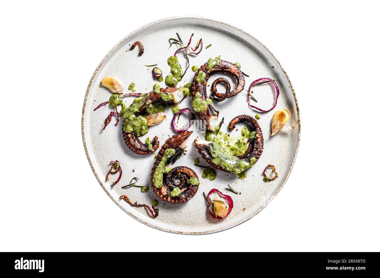 Cooked octopus tentacles with pesto, thyme and onion. Isolated on white ...