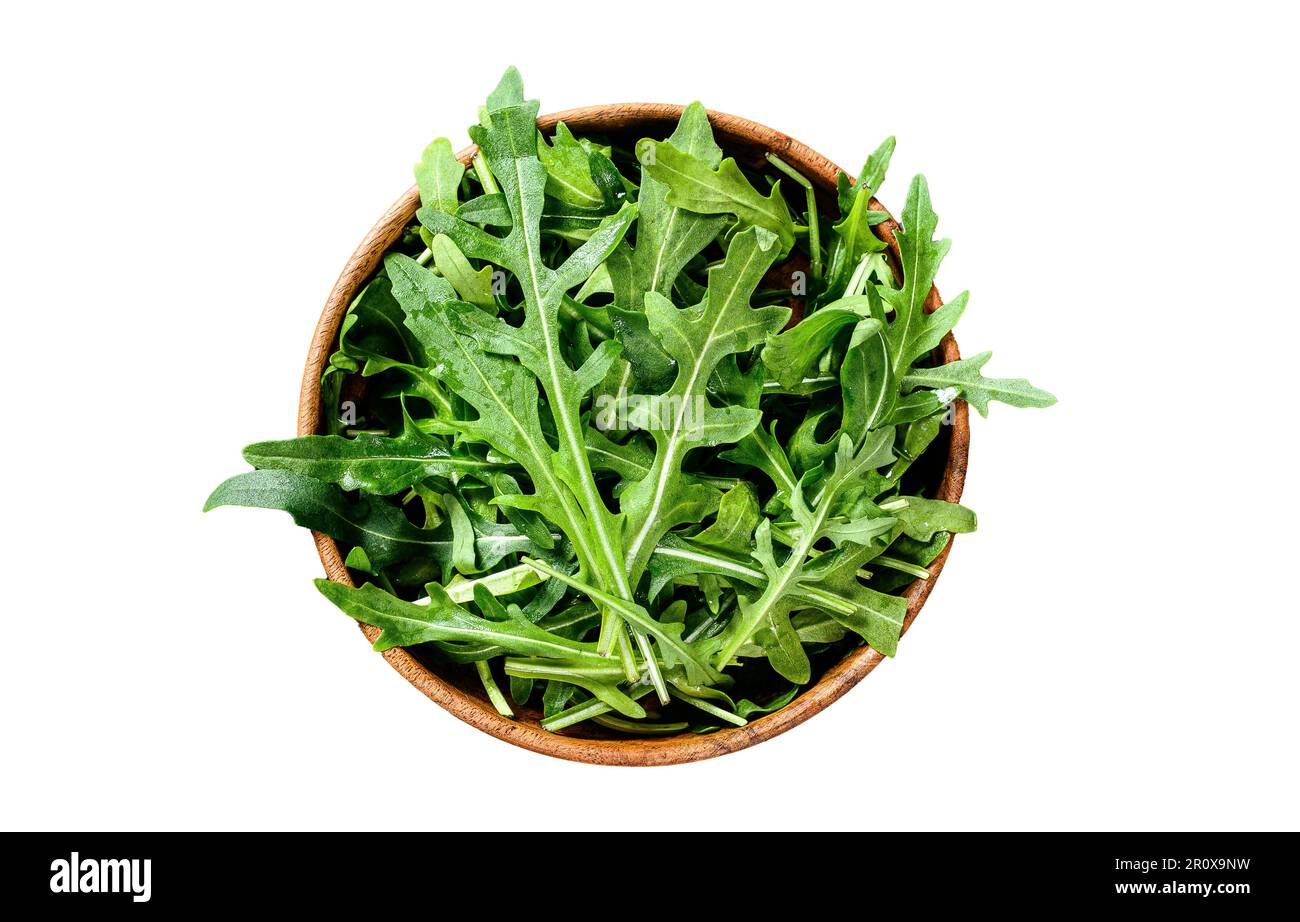 Fresh rucola in a wooden bowl. Isolated on white background Stock Photo ...