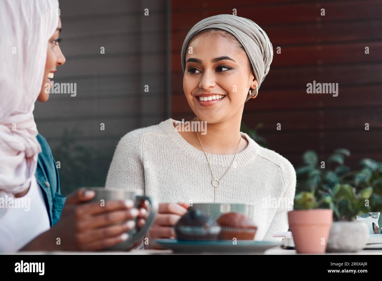 Friends, coffee and smile with Muslim women in cafe for conversation ...