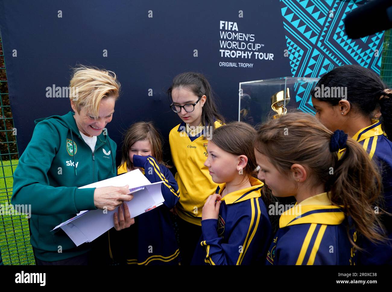 Republic of Ireland manager Vera Pauw looks through drawings done by ...