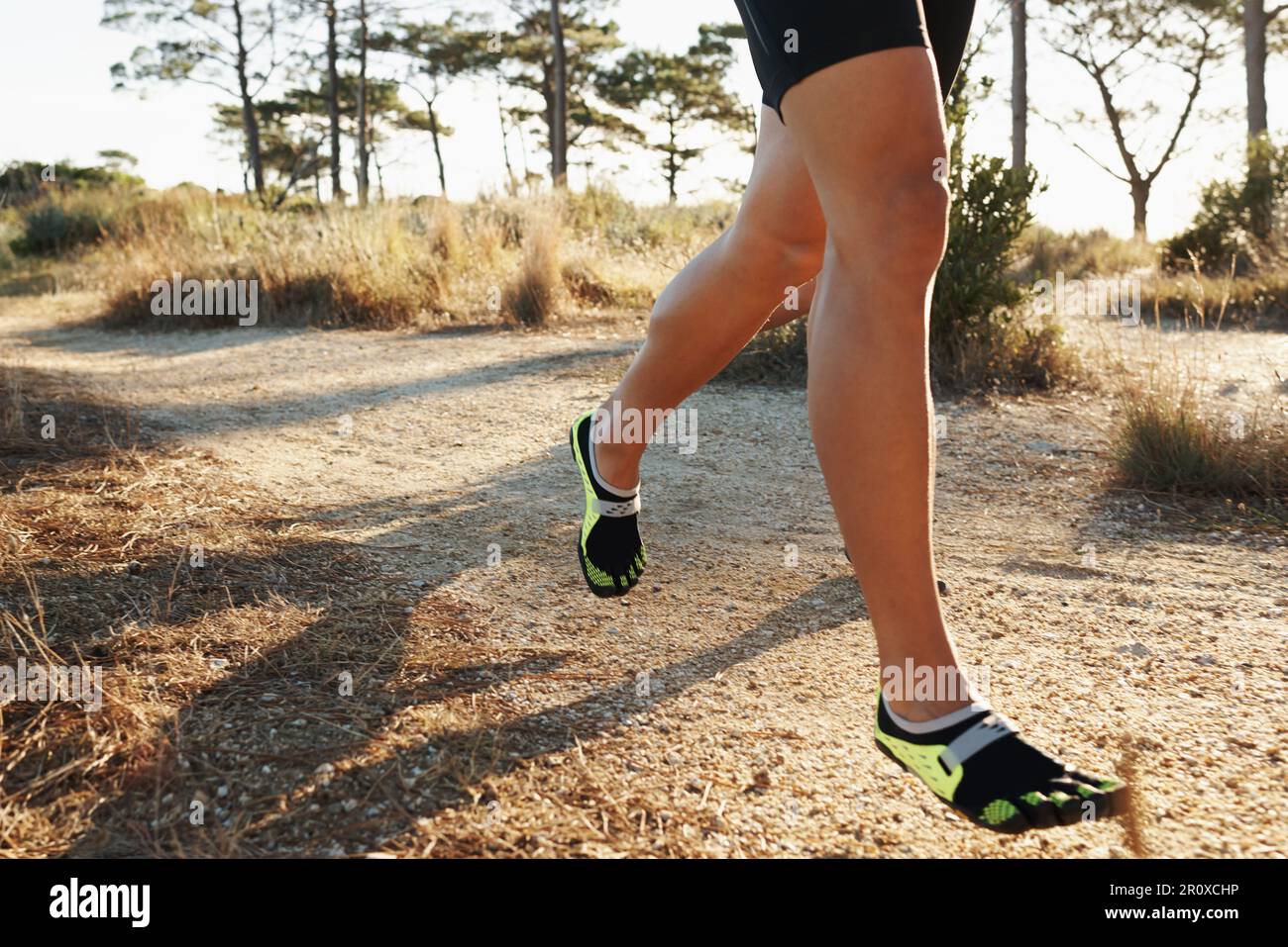 These legs were made for running. A young athlete running outdoors ...