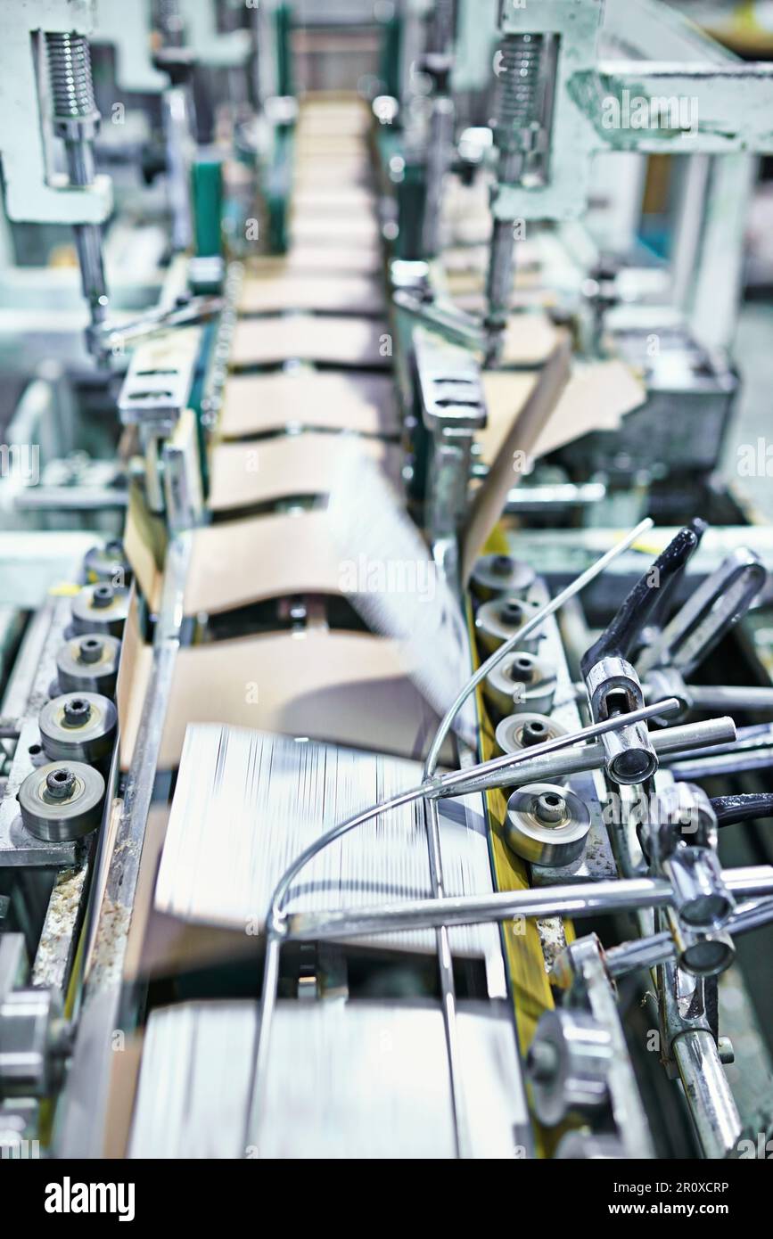 Printing automation. Detail shot of the workings of a printing factory ...