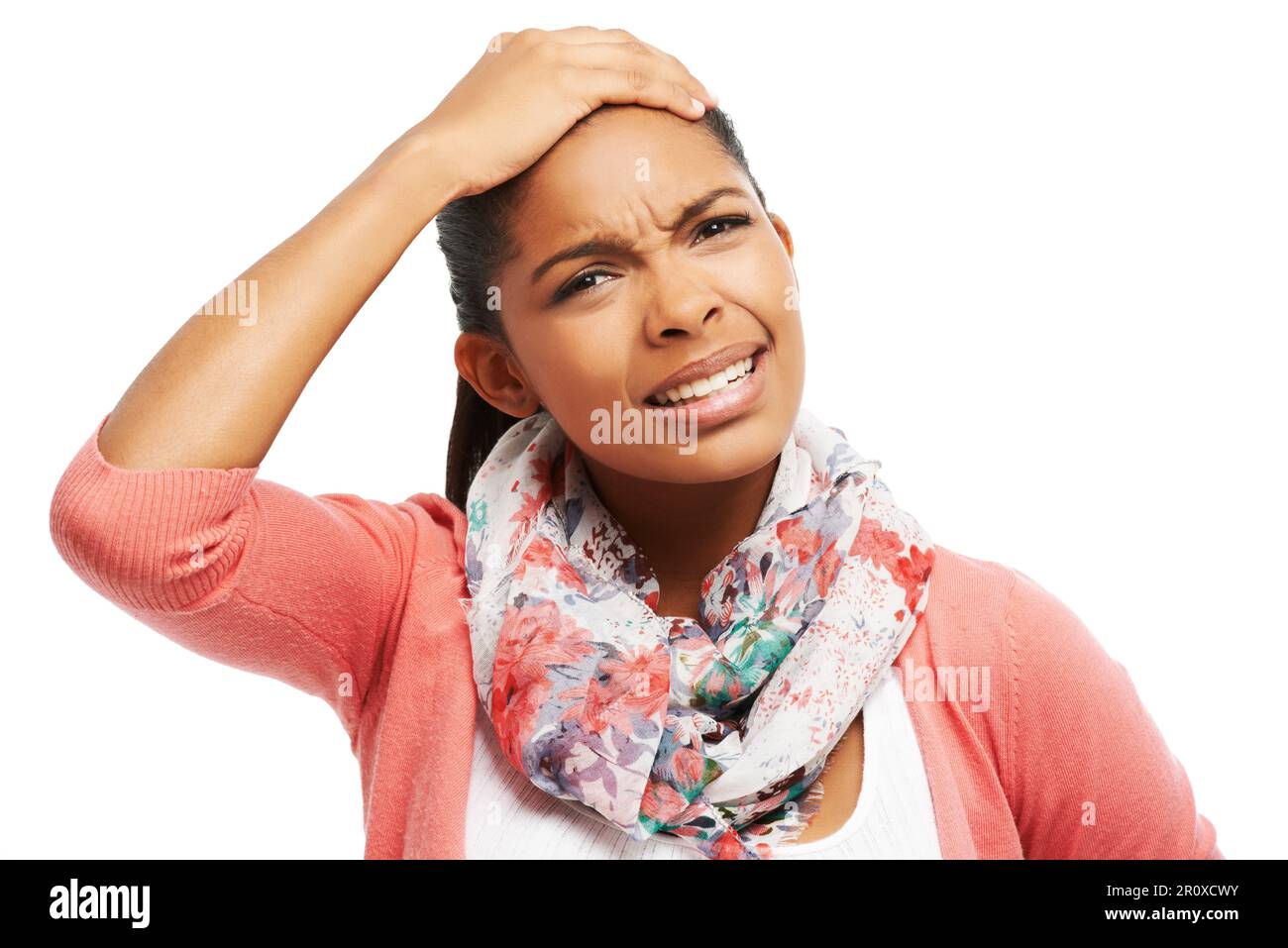 Stuck with an annoying headache. Young woman grimacing in pain at a bad ...