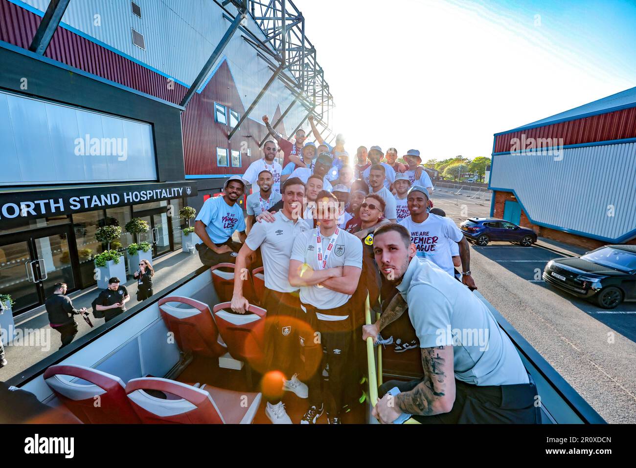 Burnley players pose for a photo during an open top bus parade from ...