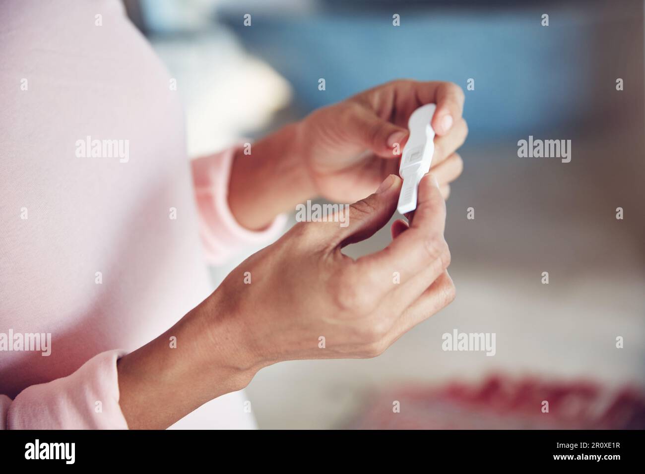 Closeup, hand and woman with a pregnancy test, waiting for the results ...