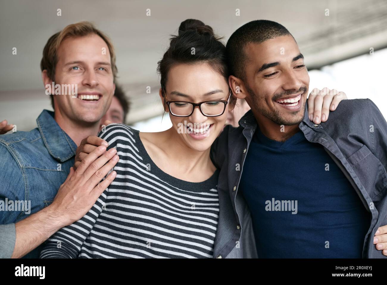 More than just coworkers, theyre friends. a group of smiling coworkers ...