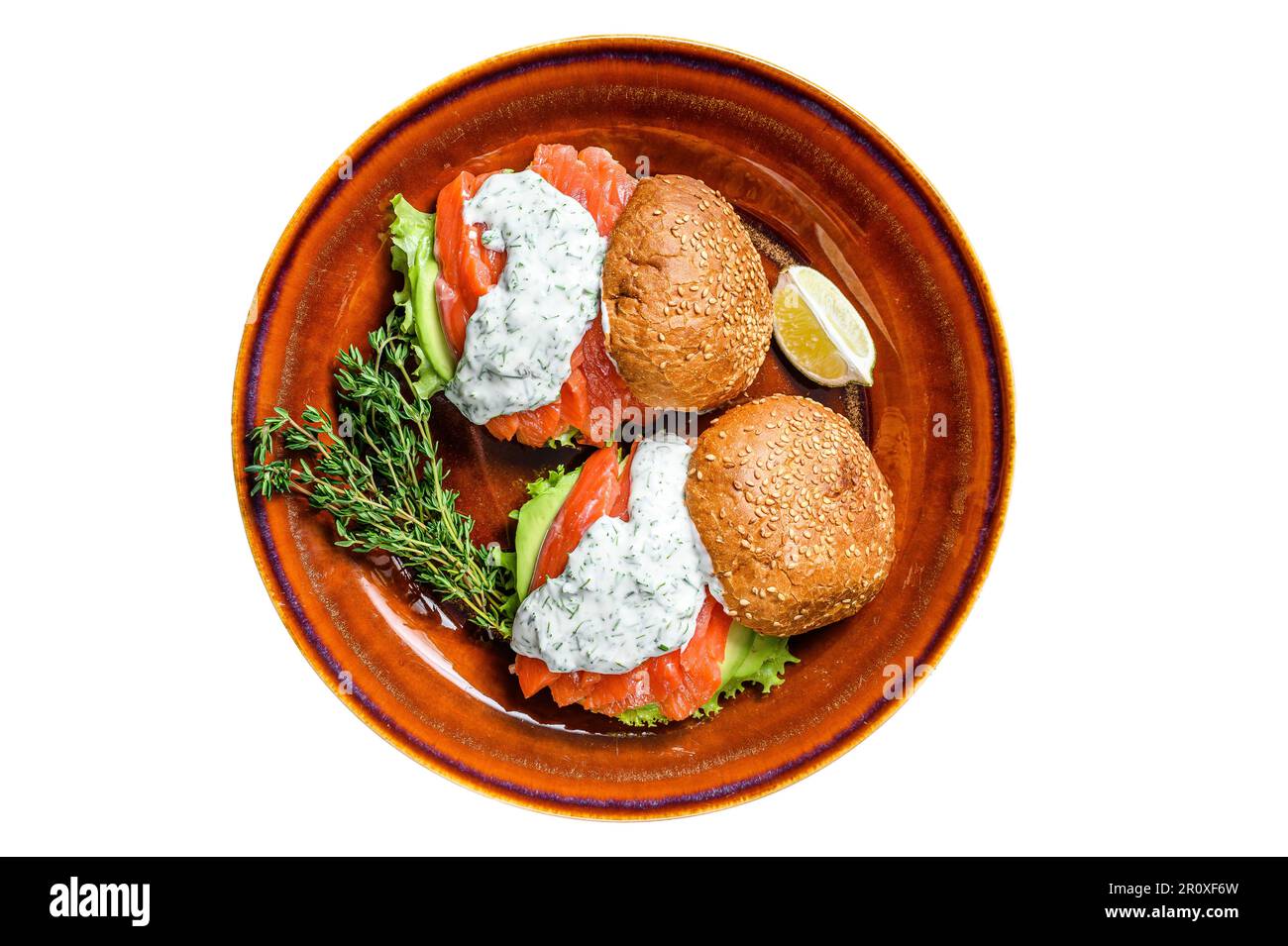 Fishburger with salted fish salmon, avocado, burger bun, mustard sauce ...