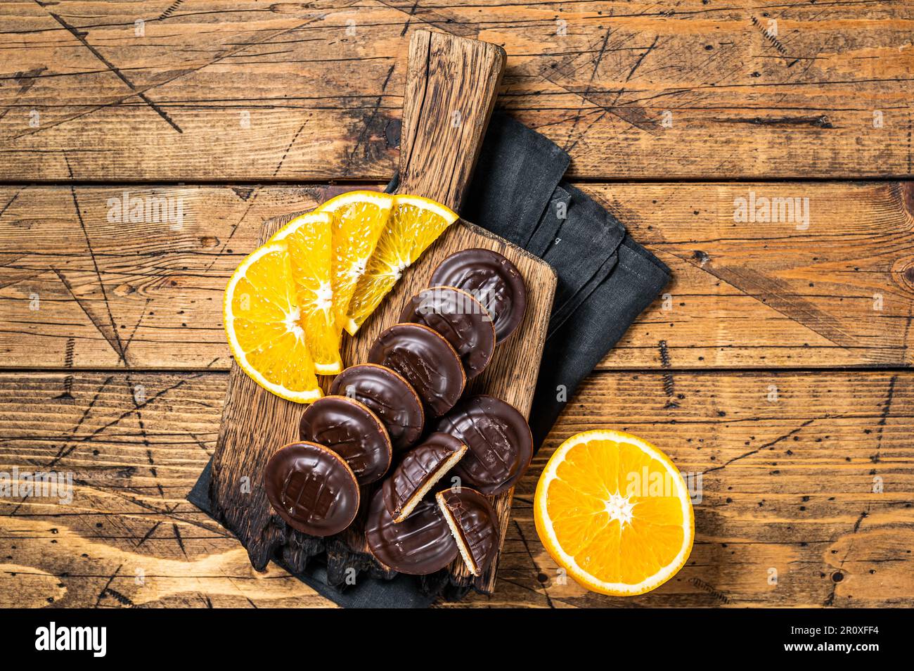 Chocolate Jaffa Cakes with Orange Flavored Marmalade. Wooden background ...