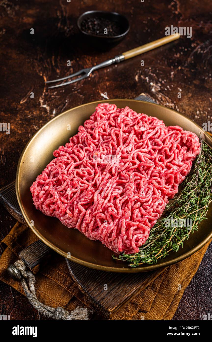 Fresh mutton lamb Mince Meat, raw ground meat. Dark background. Top ...