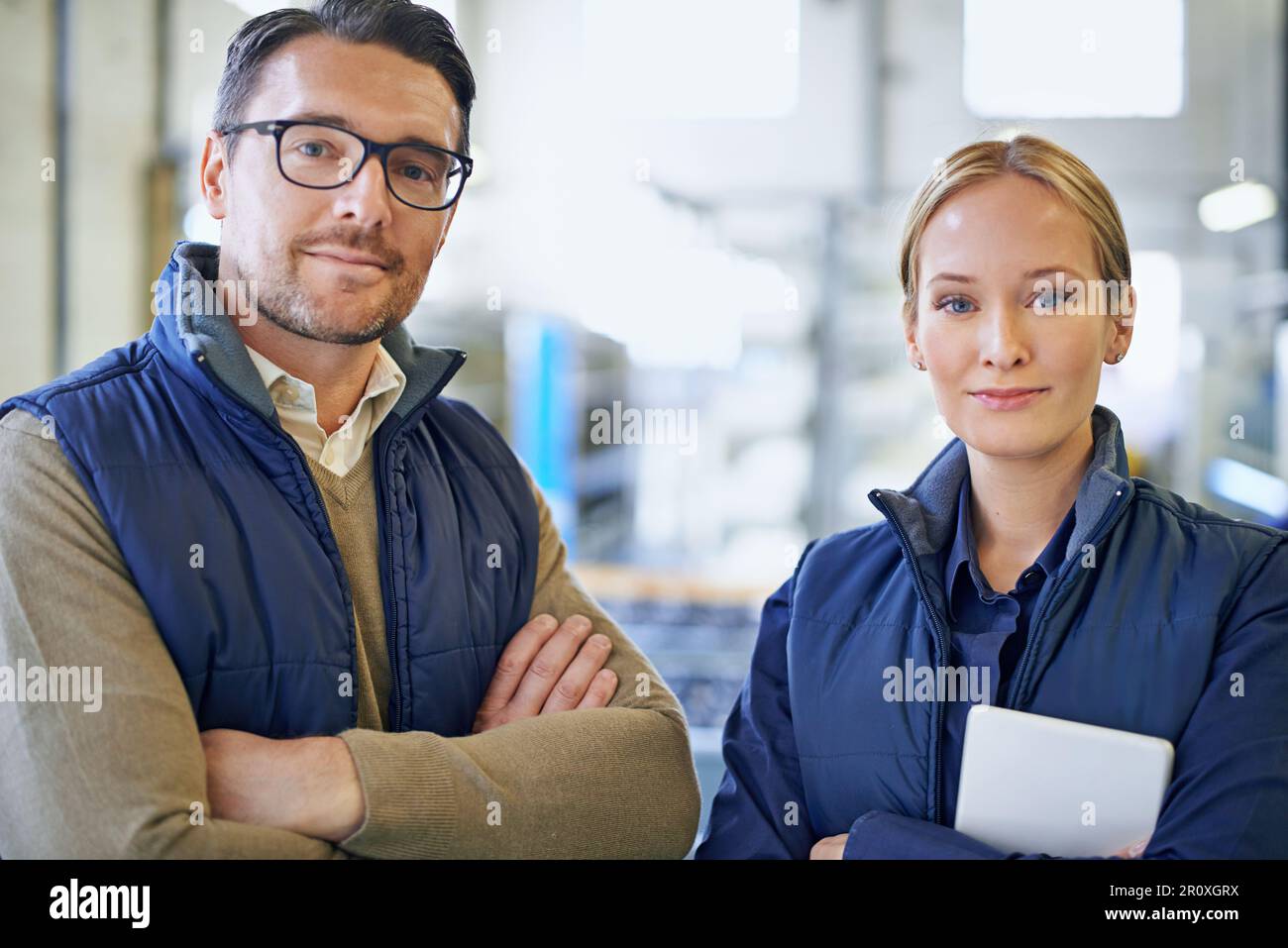 Running the warehouse with confidence. Portrait of a two smiling ...