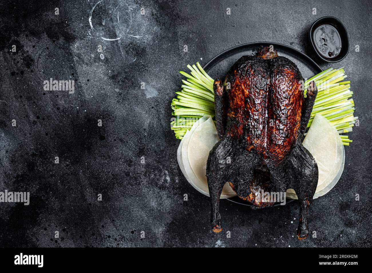 Traditional whole roasted Christmas Peking duck with herbs and sauce ...