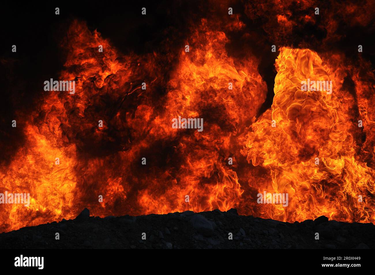 industrial background of a wall of flame Stock Photo - Alamy
