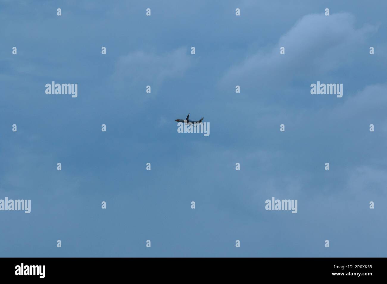 A small passenger plane was flying through a large cloud of rain Stock ...