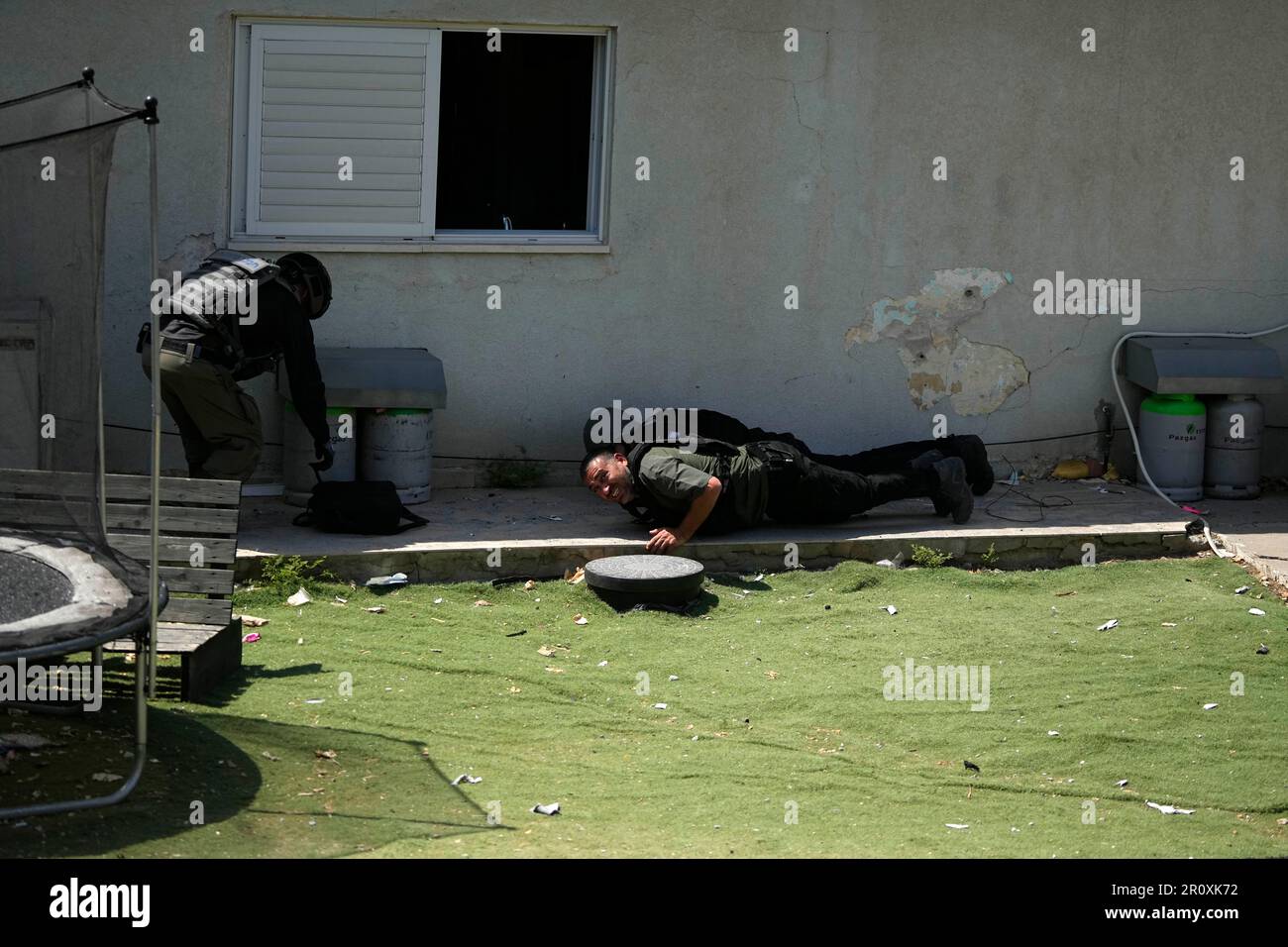 Israeli Security Forces Take Cover During An Air Raid Siren Warning Of