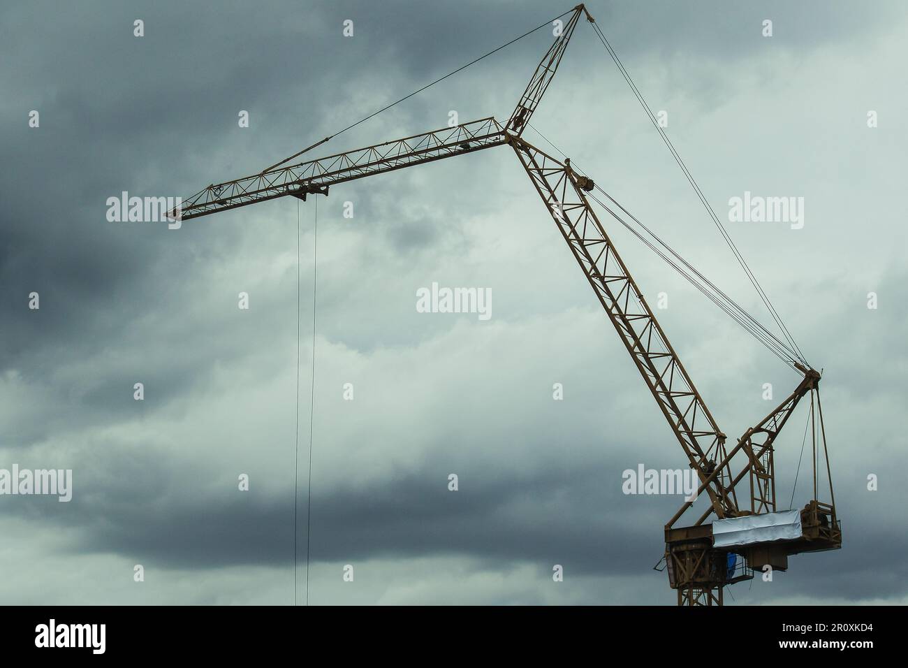 Building cranes are used in construction to lift materials to the ...