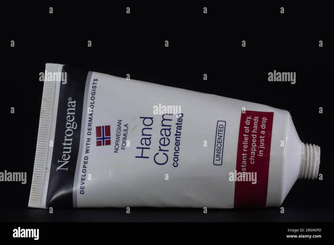 Picture of a hand cream tube with the logo of Neutrogena taken isolated ...
