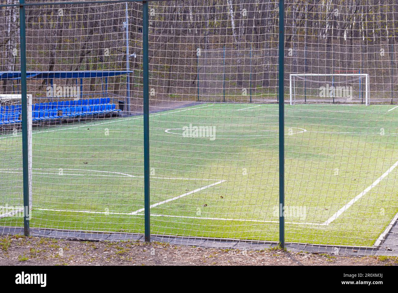 safety net on an empty football field. soccer field net. mini football ...