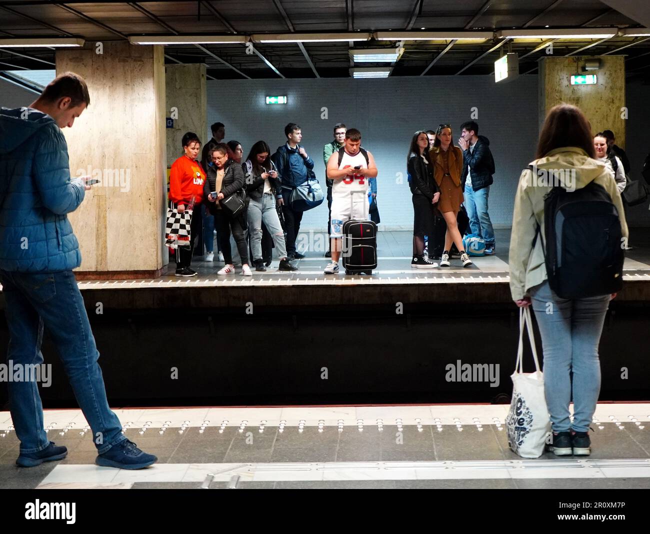 Young people waiting for the metro train in subway station in Bucharest ...