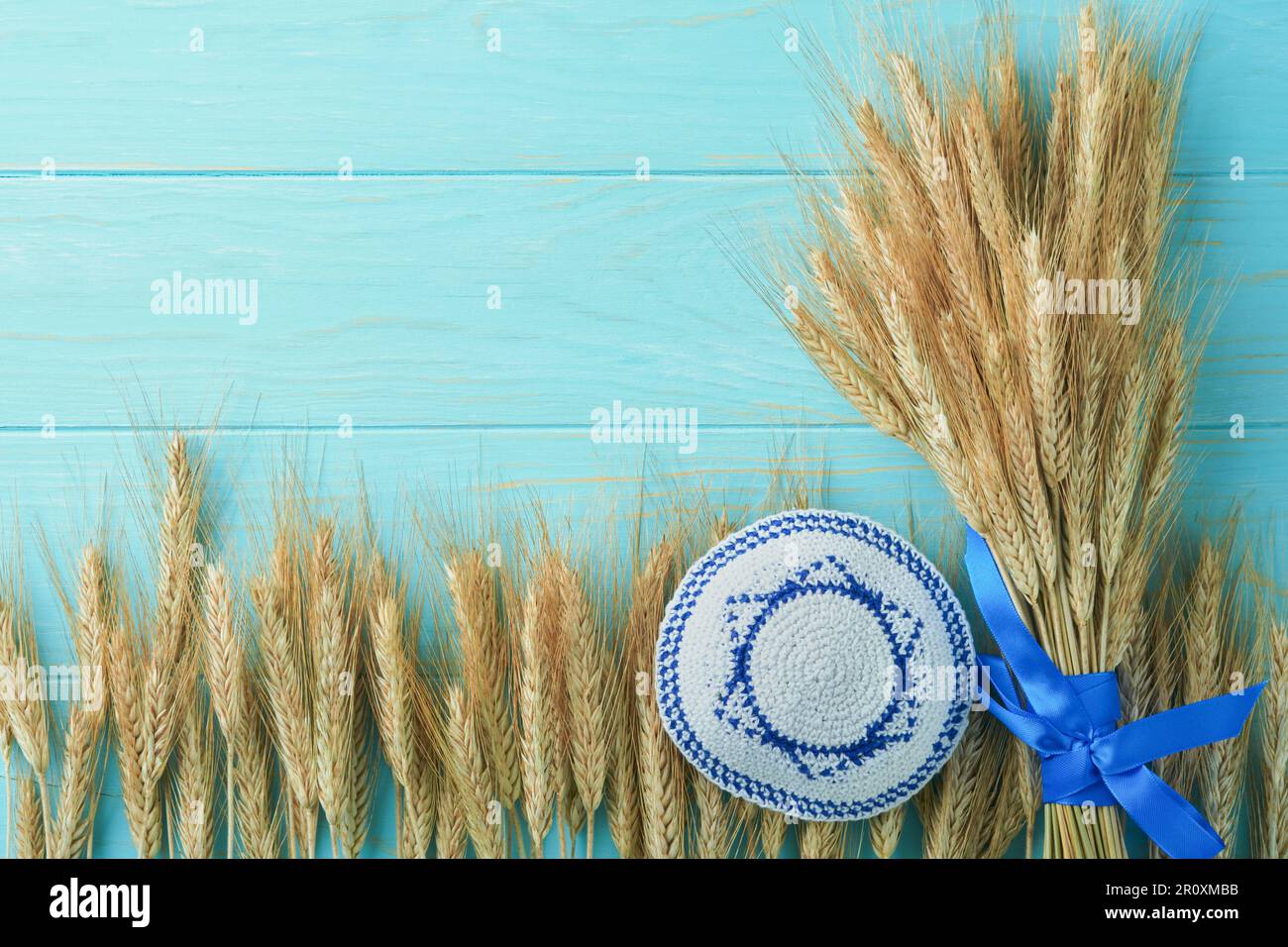 Shavuot jewish holiday celebration. Bouquet of golden ripe wheat with ...